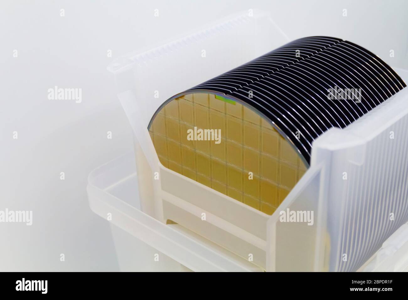 Close up of Silicon wafers gold yellow color with chip cells prepared ...