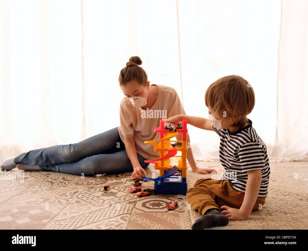Parent plays with the child Stock Photo - Alamy