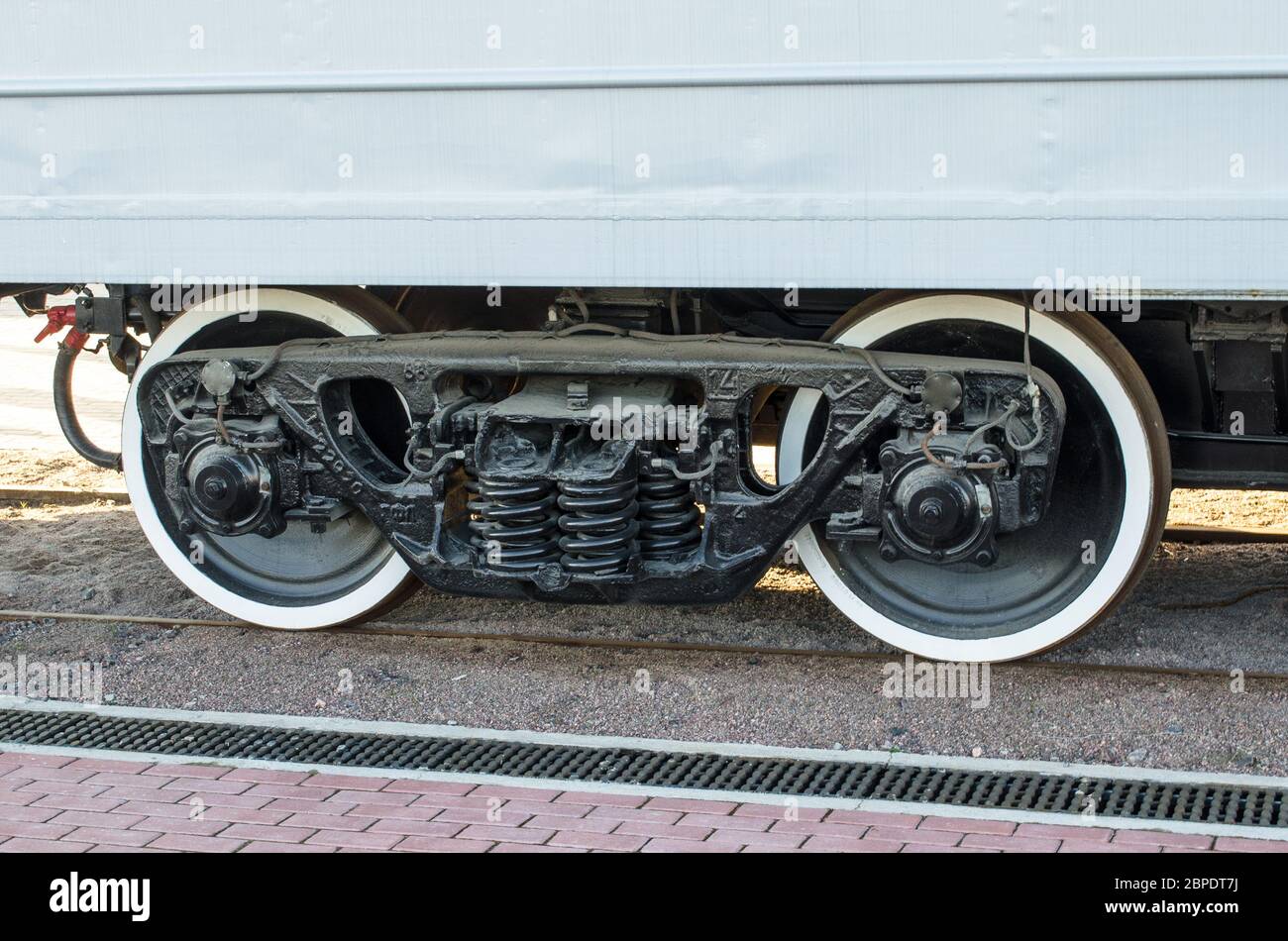 Wheels of a train a carriage, wheels with a white rim Stock Photo - Alamy