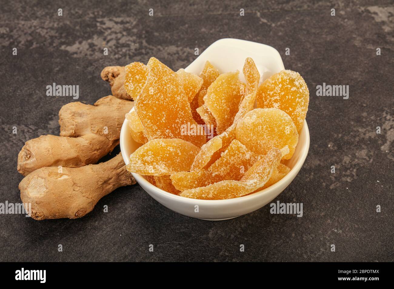 Dry sweet ginger snack in the bowl Stock Photo - Alamy