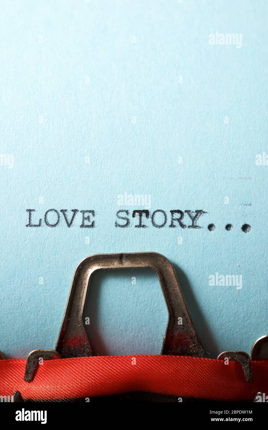 Love story text written on a paper Stock Photo - Alamy