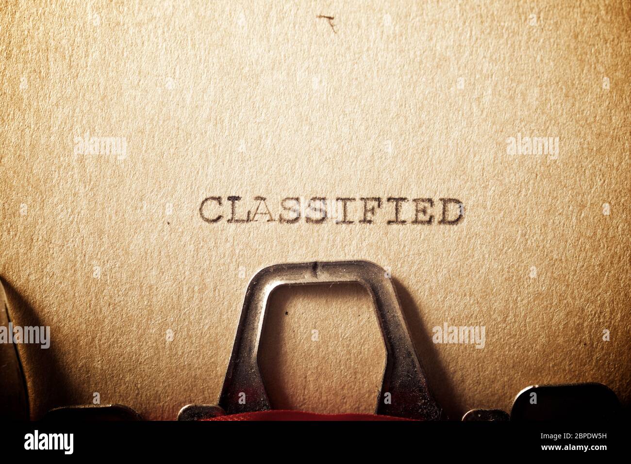 Classified word written on a paper Stock Photo - Alamy