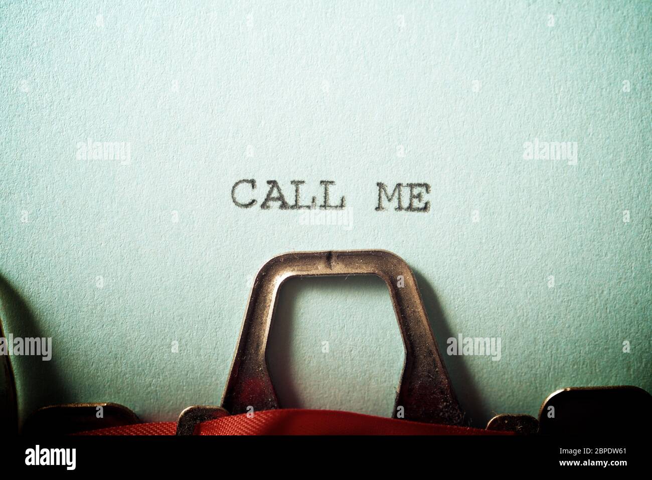 Call me text written on a paper Stock Photo - Alamy