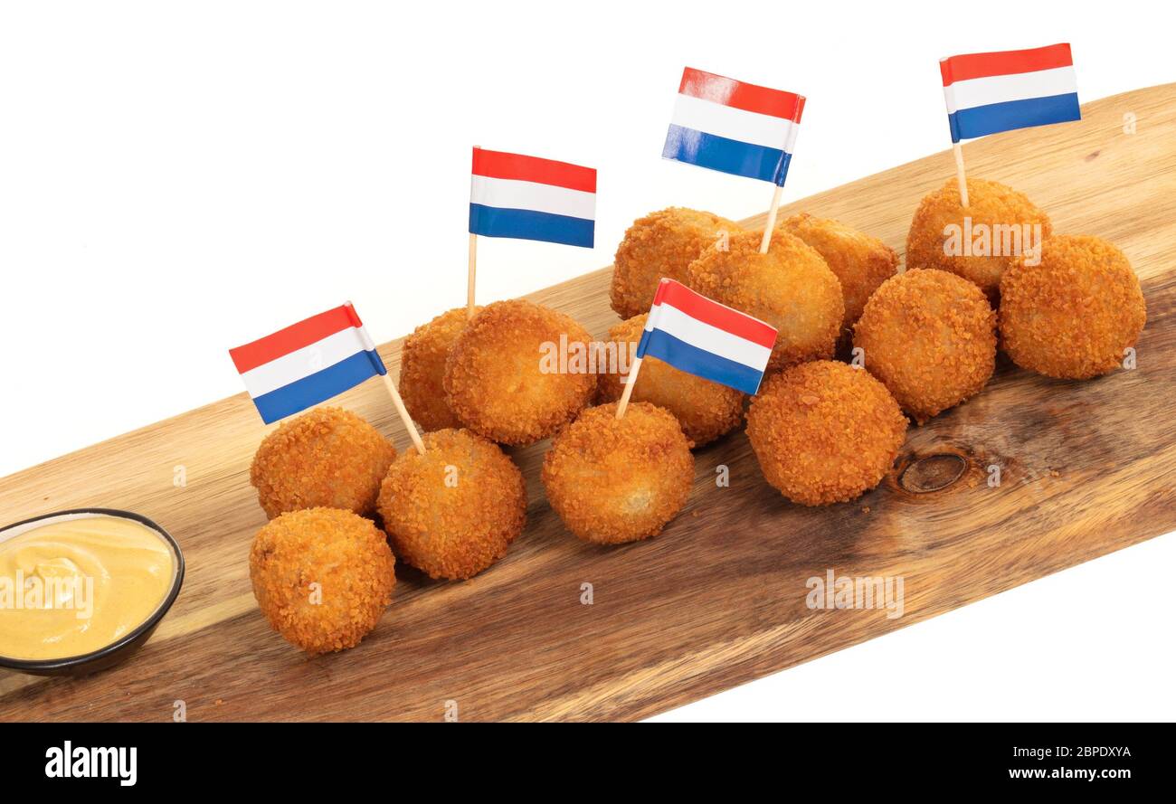 Dutch traditional snack bitterbal on a serving board, dutch flag ...
