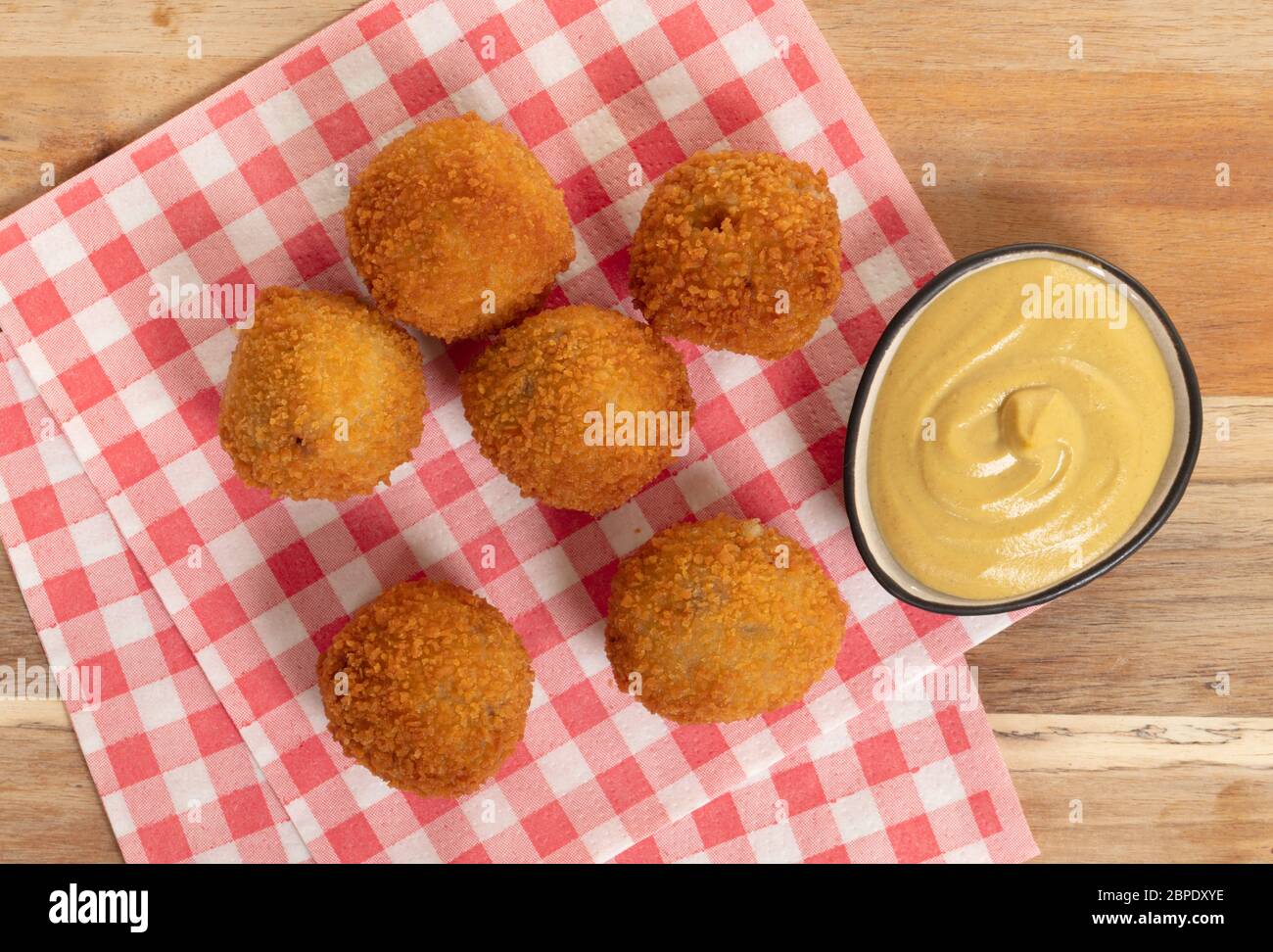 Dutch traditional snack bitterbal on a serving board, isolated Stock ...