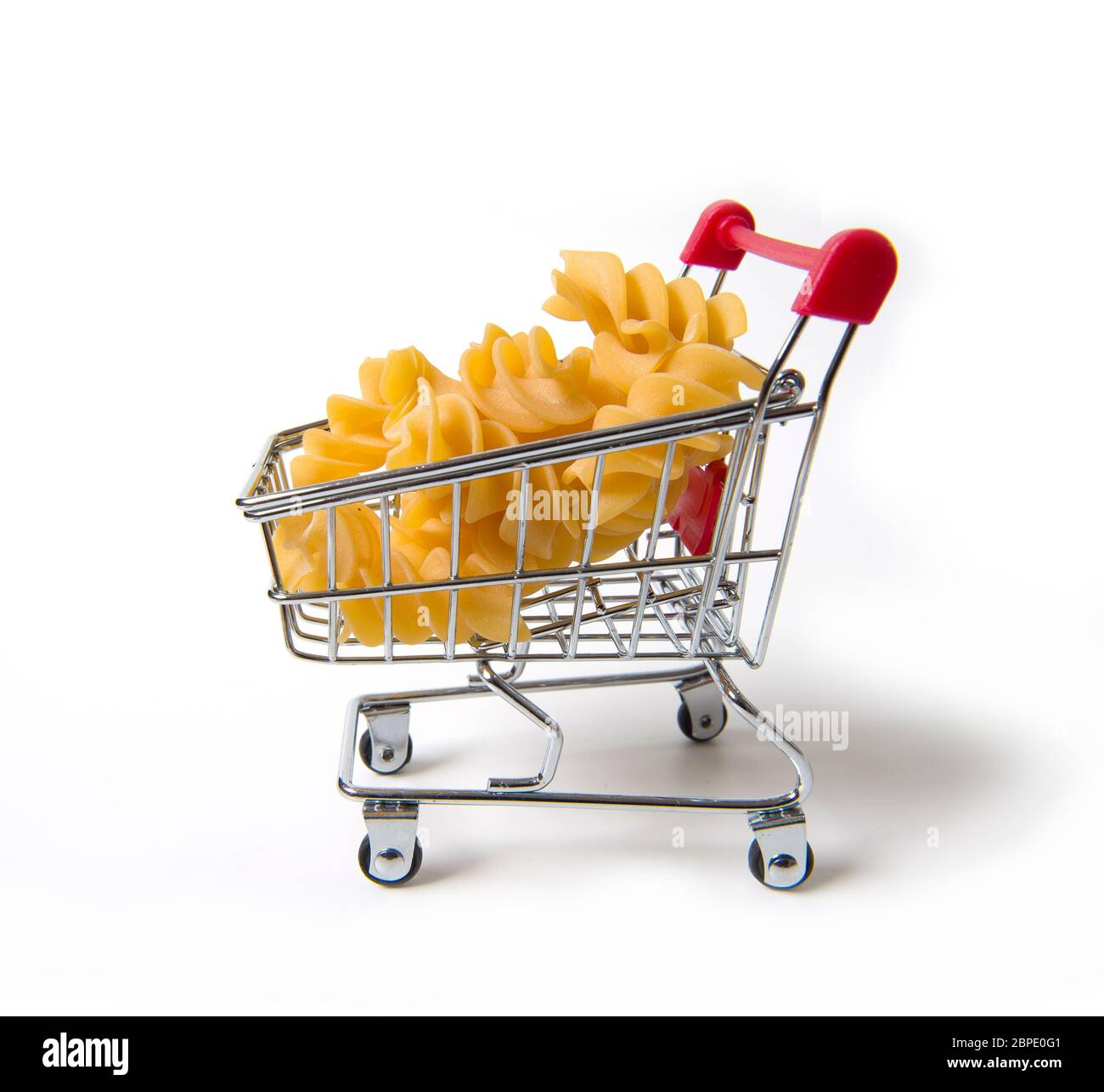 Supermarket shopping trolley on a white background filled with fusilli ...