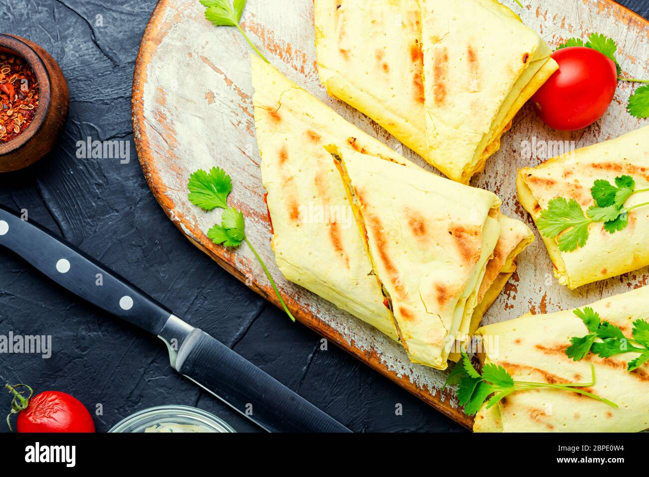 Traditional eastern shawarma with chicken,cheese and mushrooms on ...