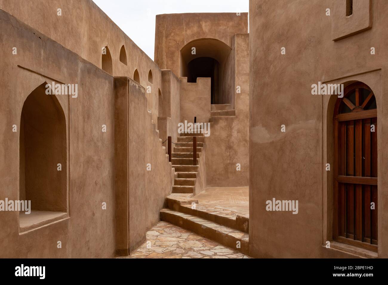 Courtyard of Jibreen Castle, Oman with stairs, doors and other ...