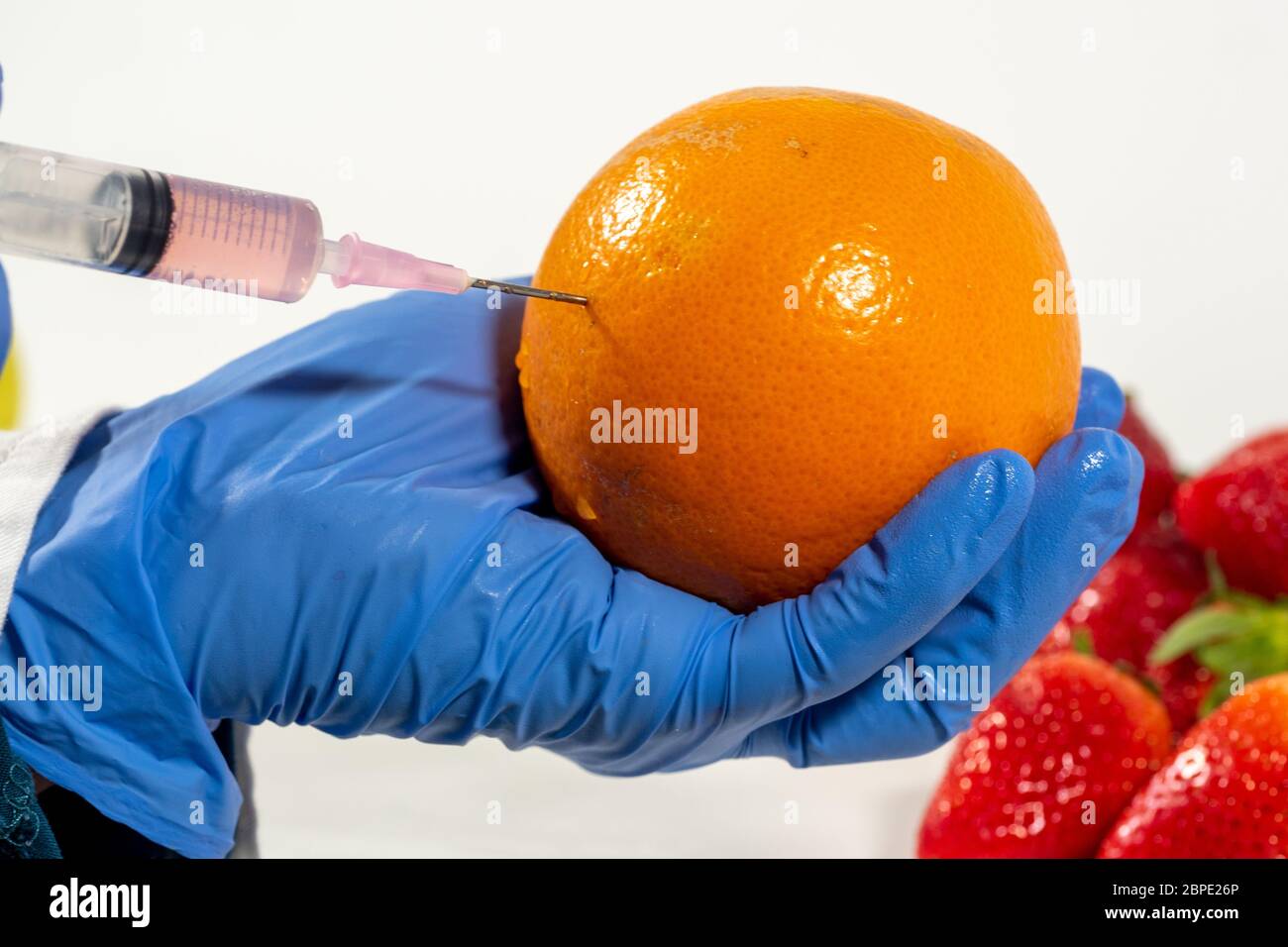 Syringe injecting orange fruit hi-res stock photography and images - Alamy