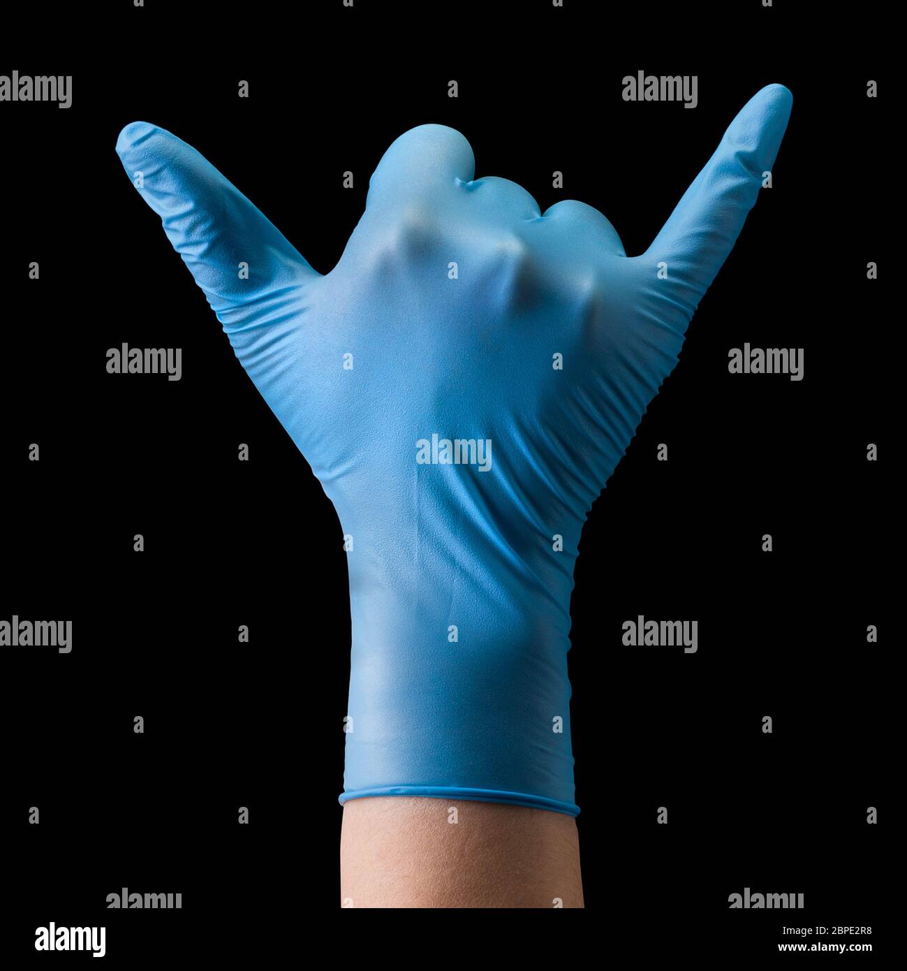 Doctor's hand in medical gloves showing Shaka or surfer sign isolated ...