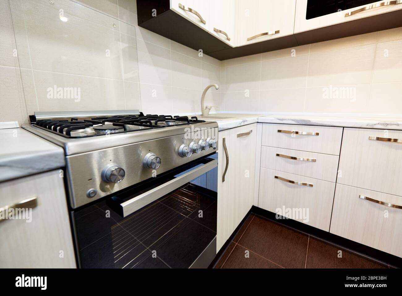 Oven on an empty kitchen in an apartment Stock Photo - Alamy