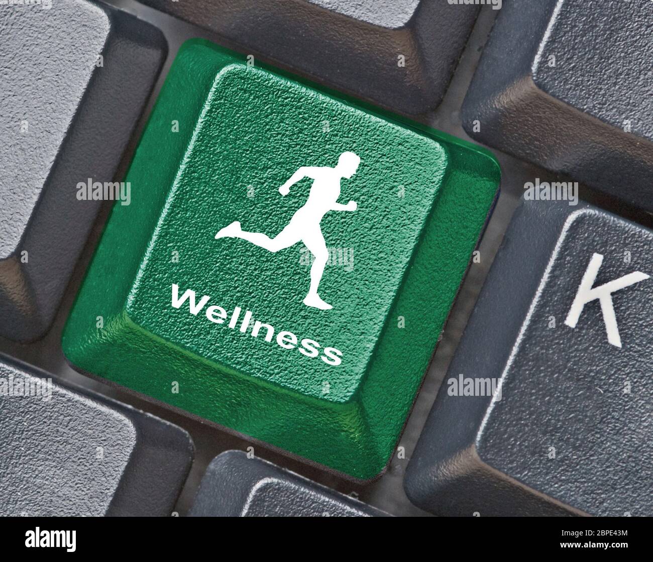 Keyboard with key for wellness Stock Photo - Alamy