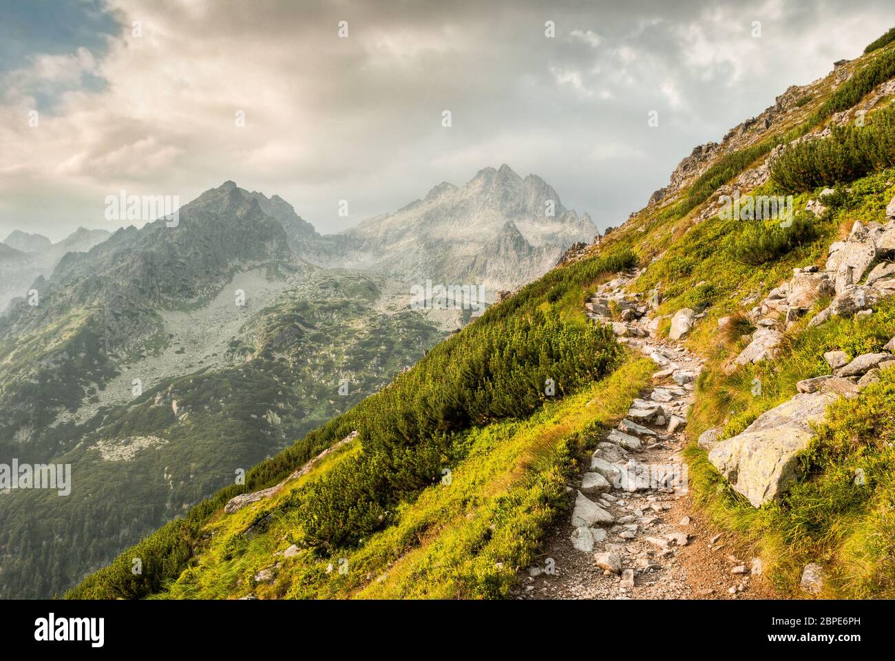 mountain landscape with a path at summer sunset Stock Photo - Alamy