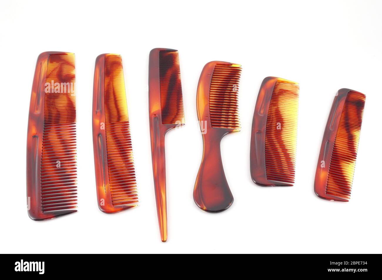 Set of plastic combs over white Stock Photo - Alamy