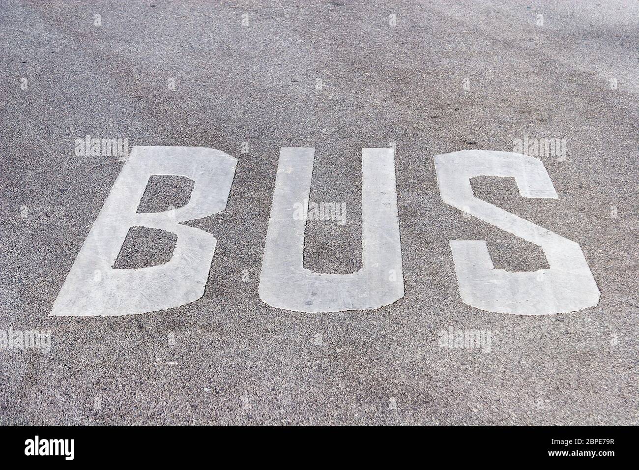 Bus lane road marking on asphalt surface Stock Photo - Alamy