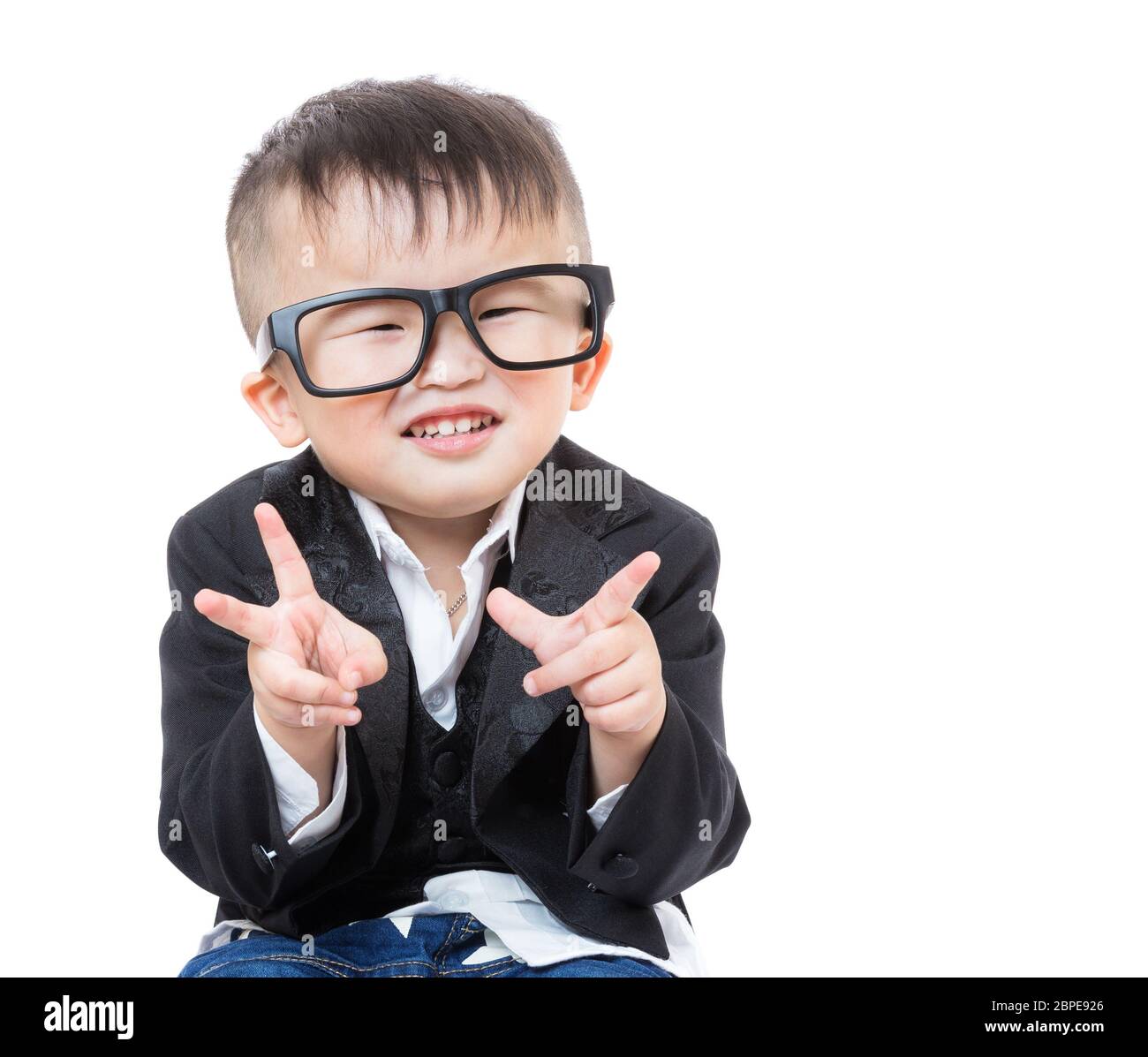 Little boy smile with victory hand gesture Stock Photo - Alamy