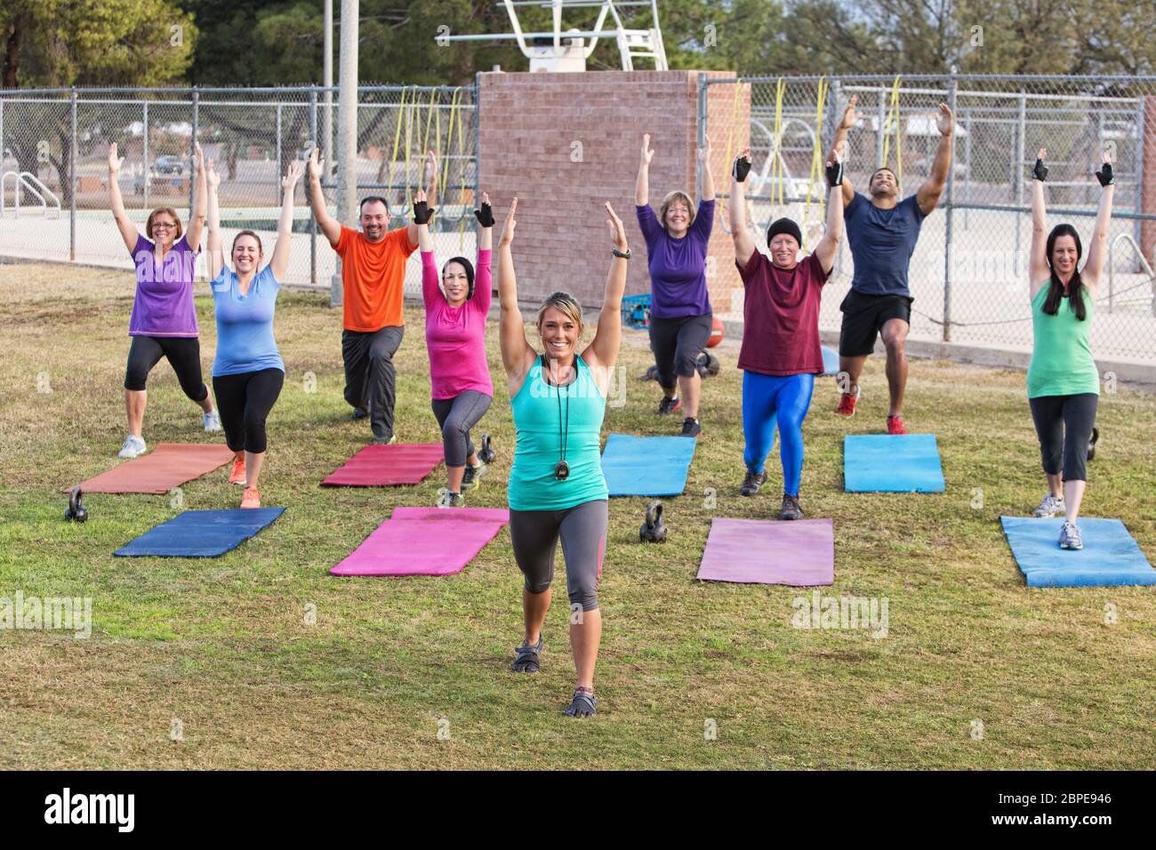 Diverse group of adults working out outdoors Stock Photo - Alamy