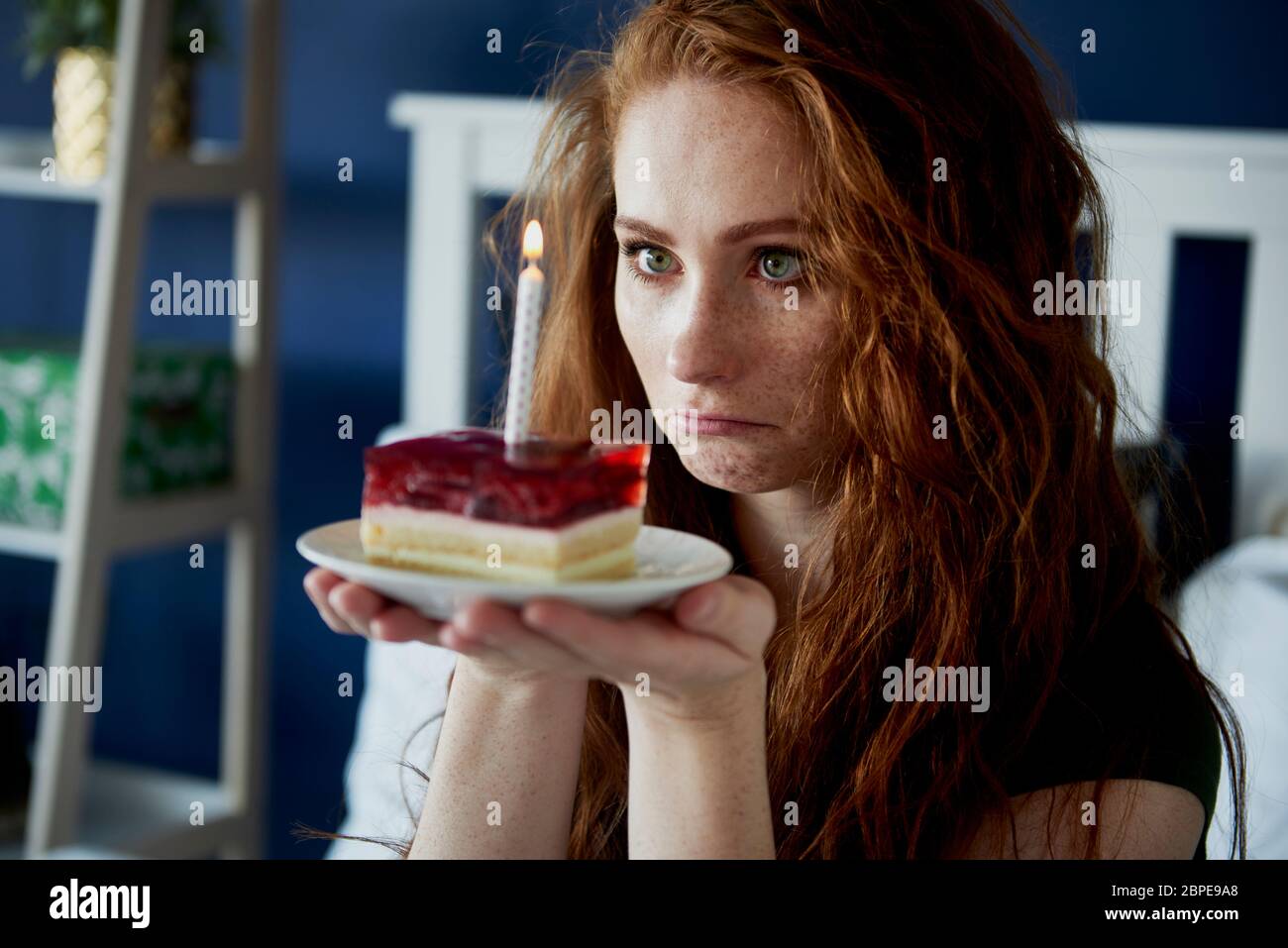 Woman not happy about her lonely birthday Stock Photo - Alamy