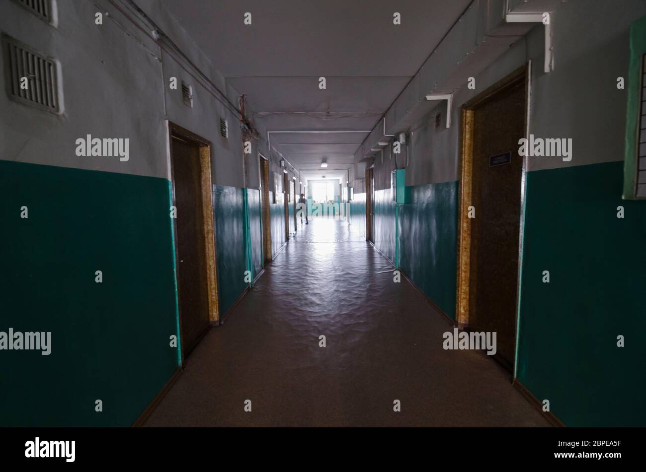 A long dark corridor with light at the end Stock Photo - Alamy