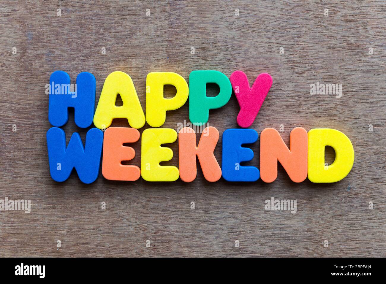 happy weekend words in wood background Stock Photo - Alamy