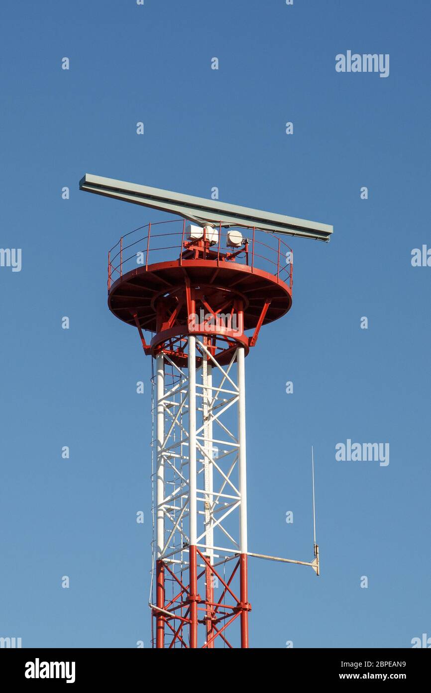 Tower with radar and antena against blue sky Stock Photo - Alamy