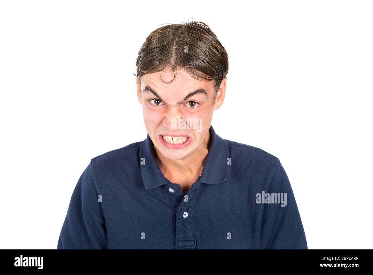 Angry geek teenage boy isolated in white Stock Photo - Alamy