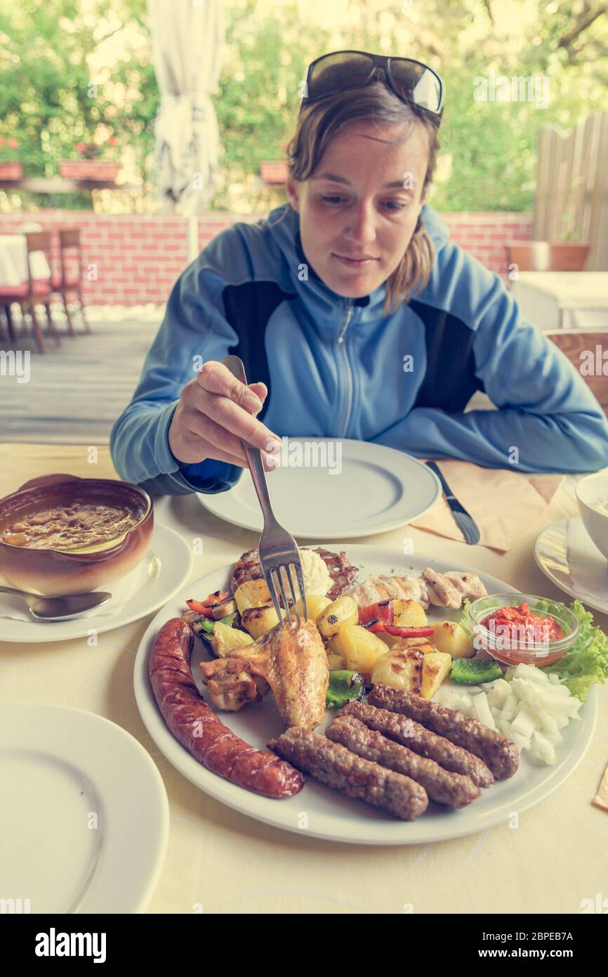 Hungry woman waiting to start eating her dish Stock Photo - Alamy