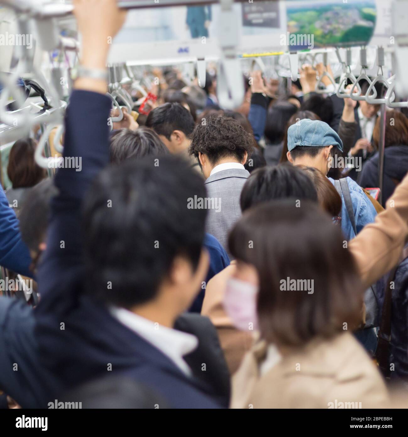 People standing in tokyo subway hi-res stock photography and images - Alamy