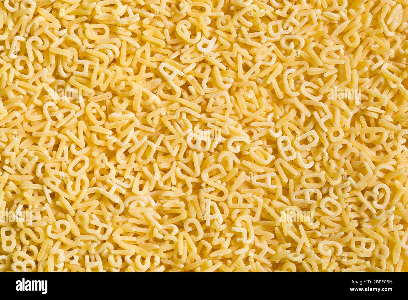 a lot of alphabet pasta Stock Photo - Alamy