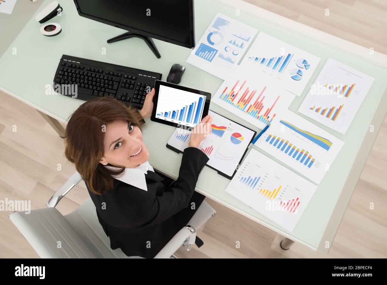 Woman manager working graphs on hi-res stock photography and images - Alamy