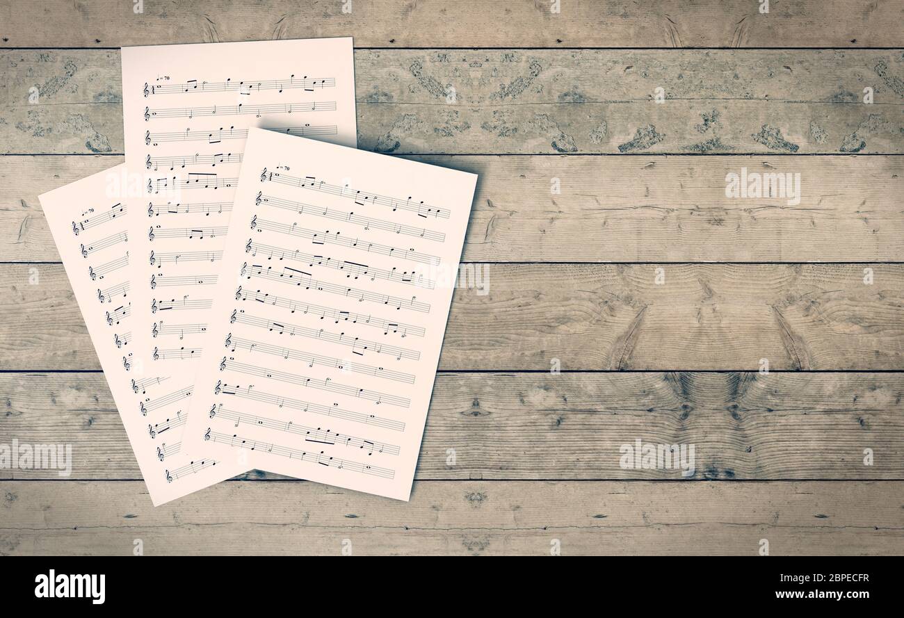 sheets music on wooden background, empty space at the right (3d render ...
