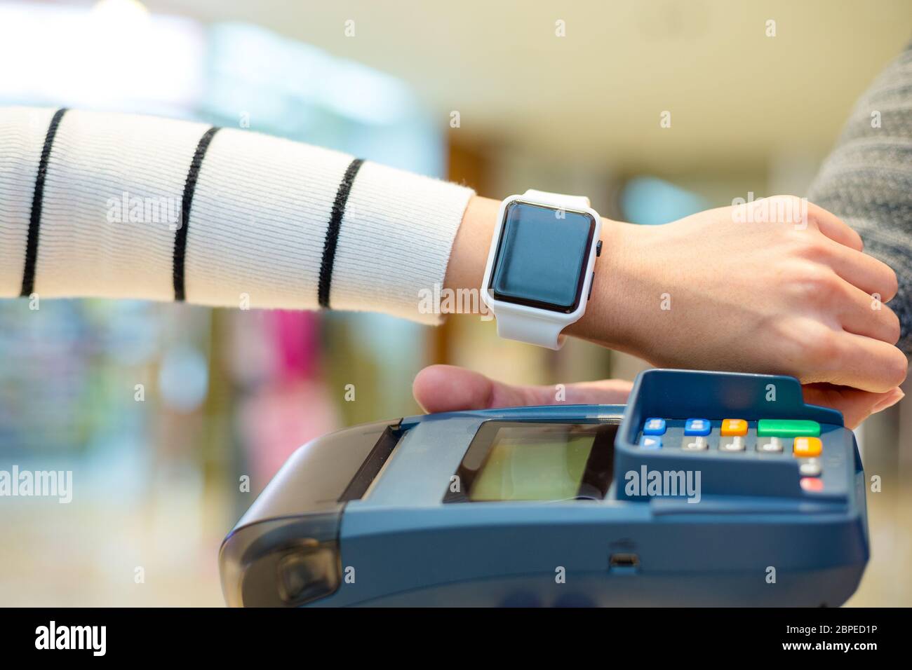 Customer using smartwatch to pay the bill by NFC technology Stock Photo ...