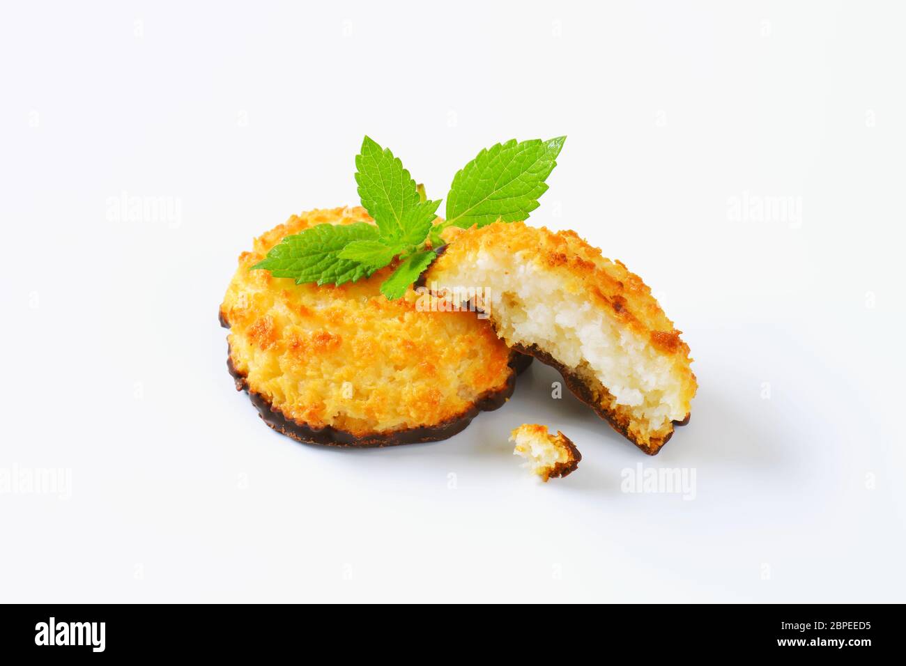 Coconut cookies dipped in bittersweet chocolate Stock Photo - Alamy