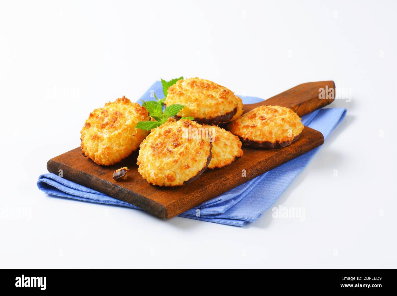 Coconut cookies dipped in bittersweet chocolate Stock Photo - Alamy