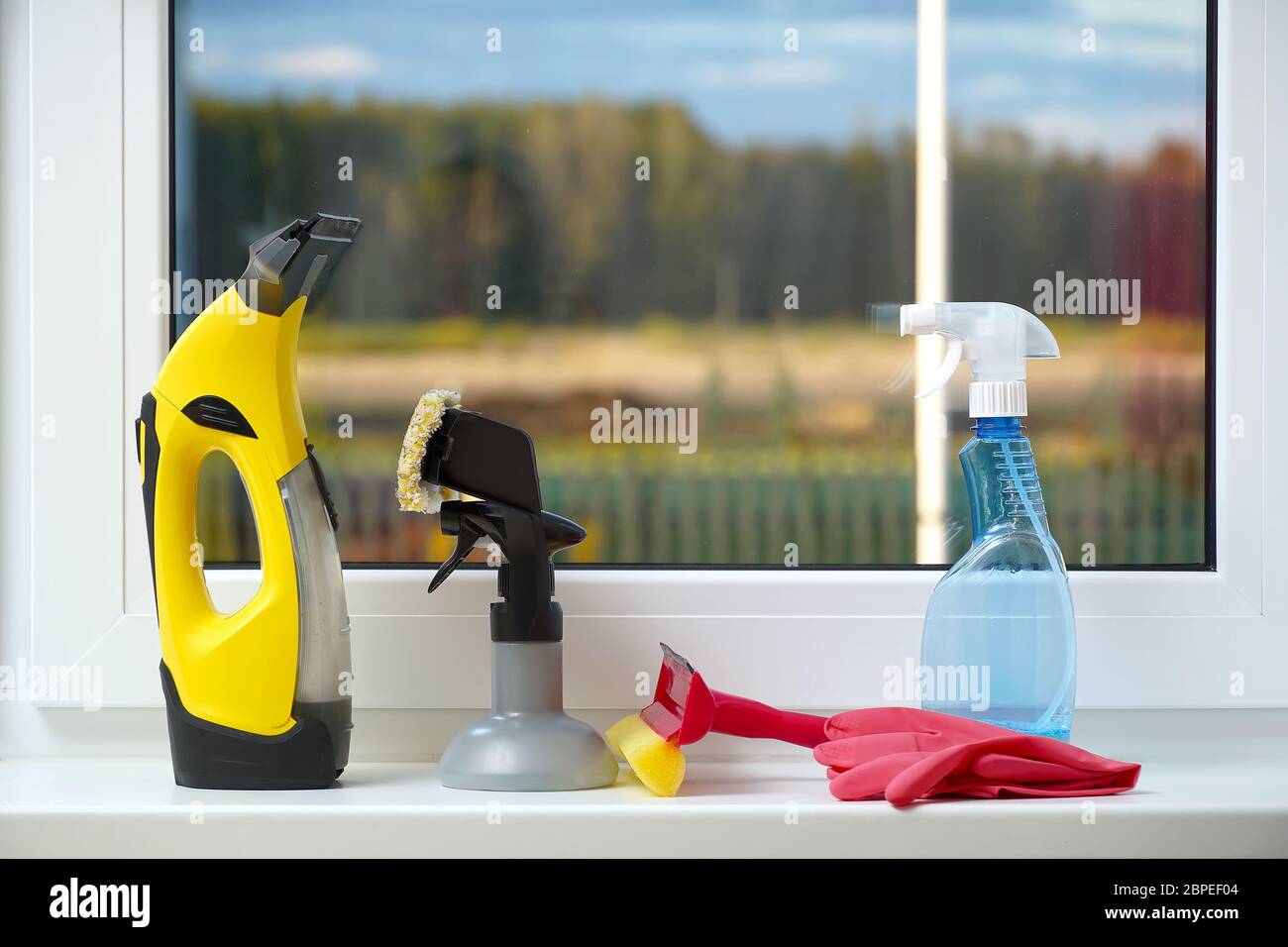 Cleaning product concept windowsill with accessories for window washing ...
