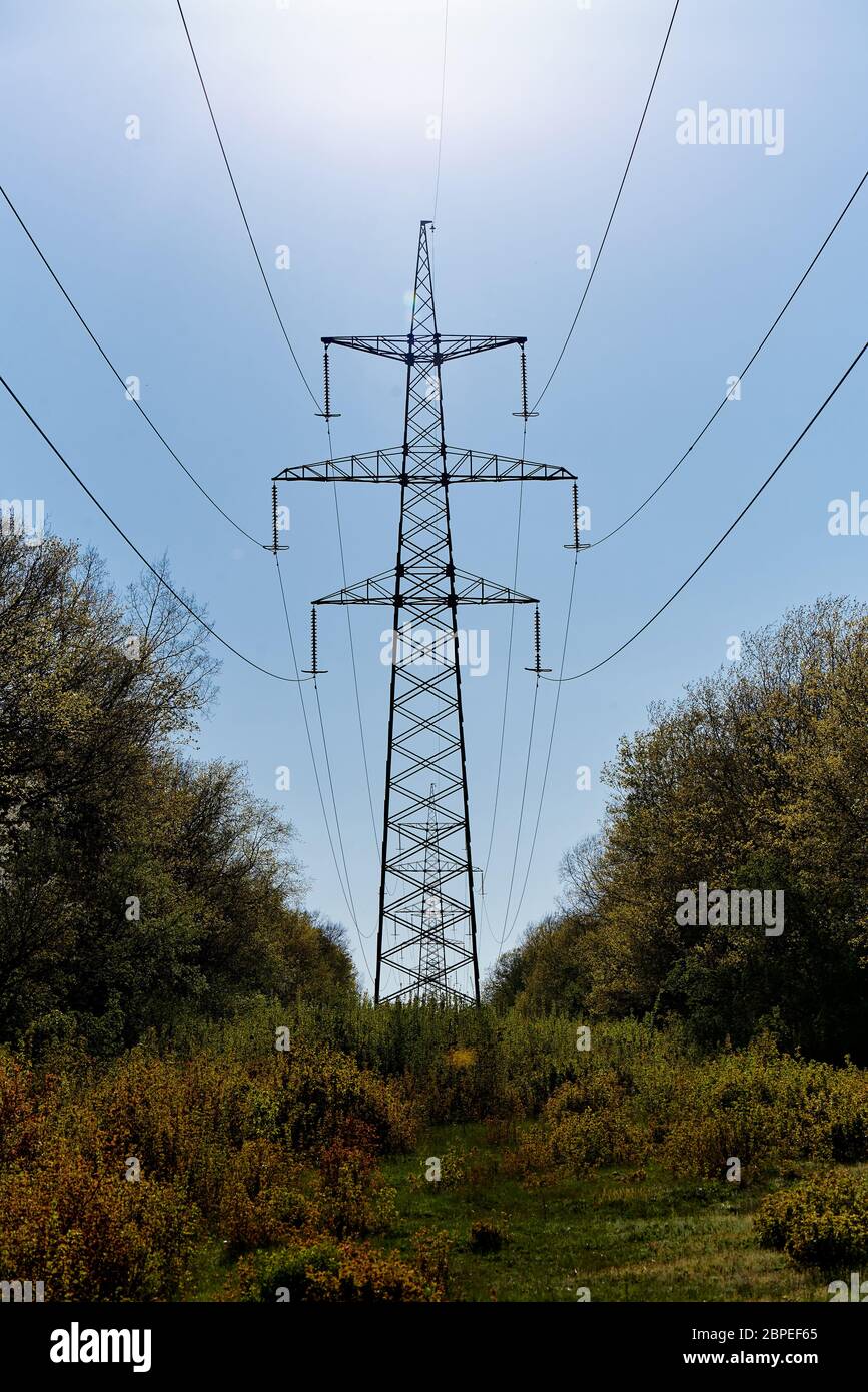Pillar overhead power line.High voltage power lines against the sky in ...