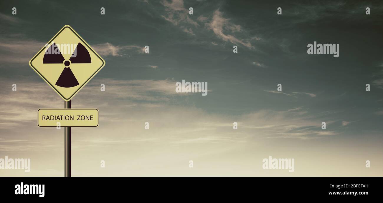 nuclear radiation warning symbol with blue sky Stock Photo - Alamy