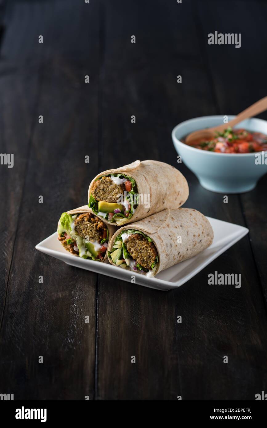 Vegetarian falafel wraps with avocado and cheese Stock Photo - Alamy