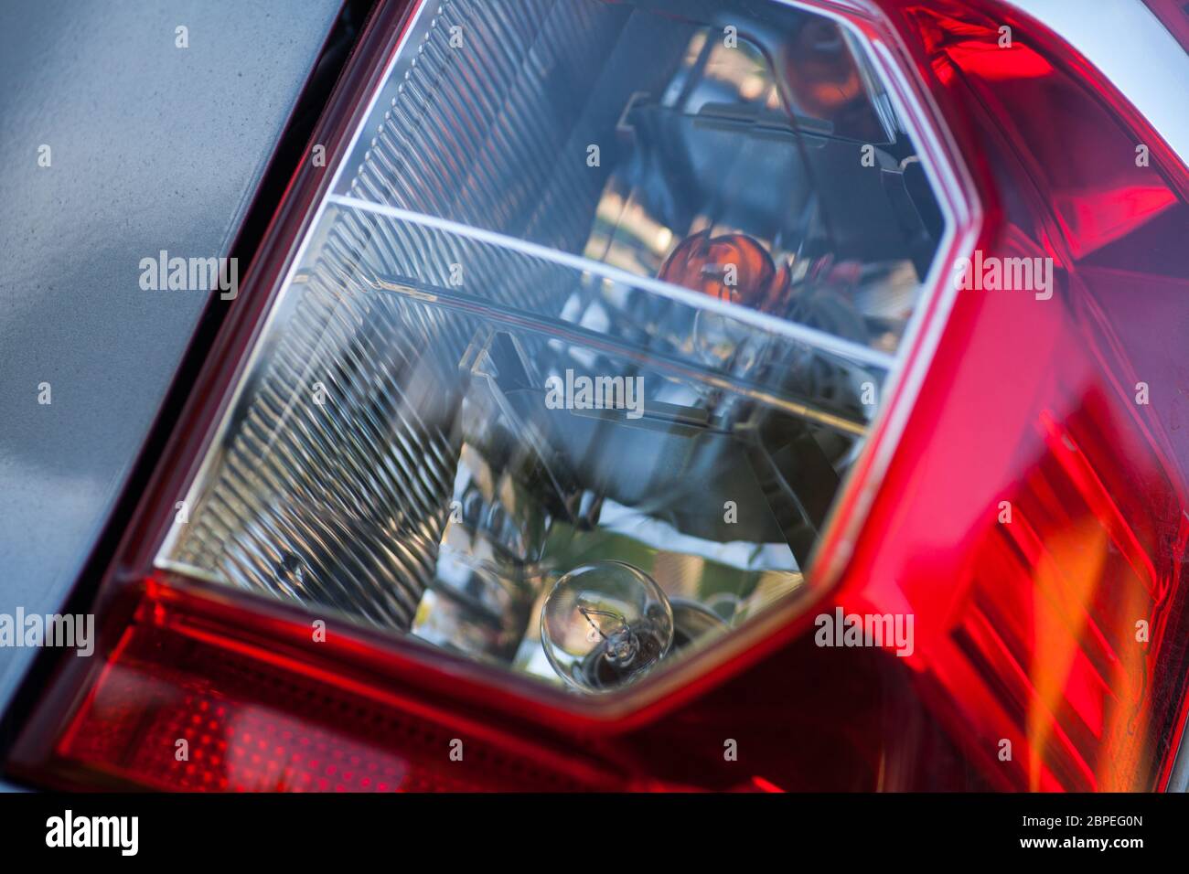 Color detail on the rear light of a car Stock Photo - Alamy