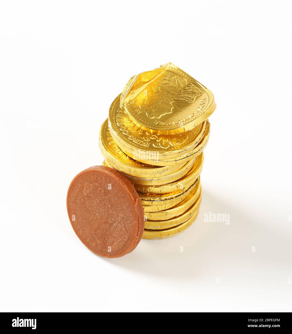 Stack of gold foiled chocolate coins Stock Photo - Alamy