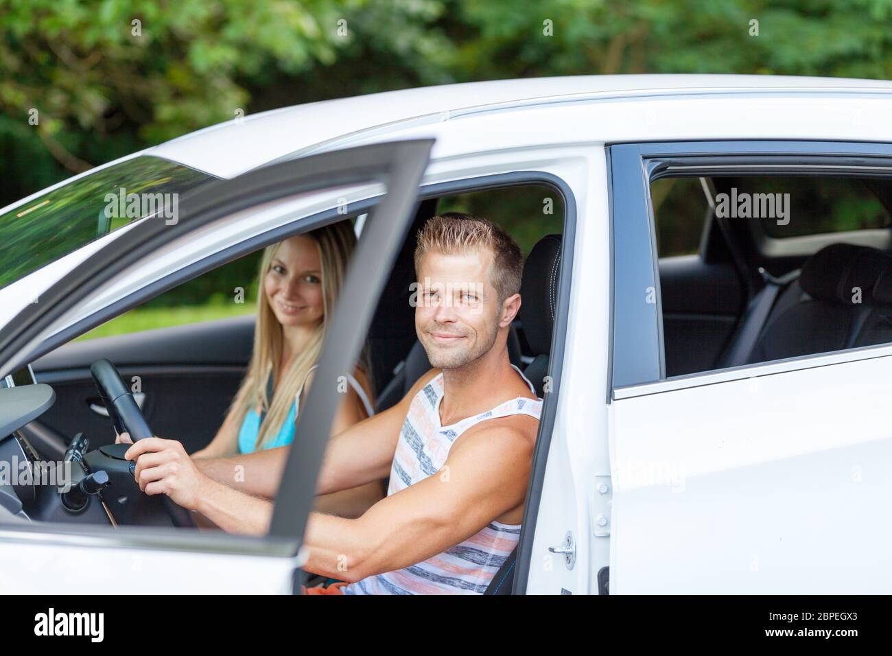 Young happy people enjoying a roadtrip in the car Stock Photo - Alamy