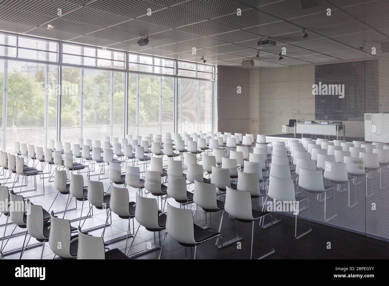 Interior of empty contemporary conference hall with white chairs Stock ...