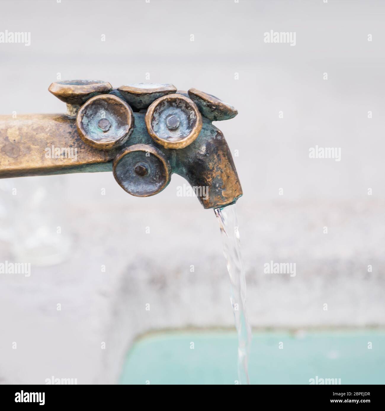 The ornamental old vintage water tap in the city center Marienplatz ...