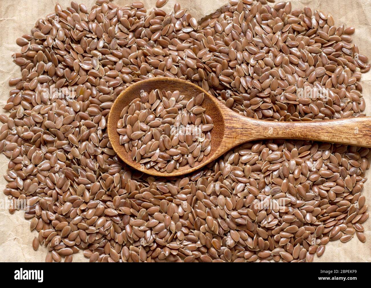 Pile of flax seeds on acraft paper background Stock Photo - Alamy