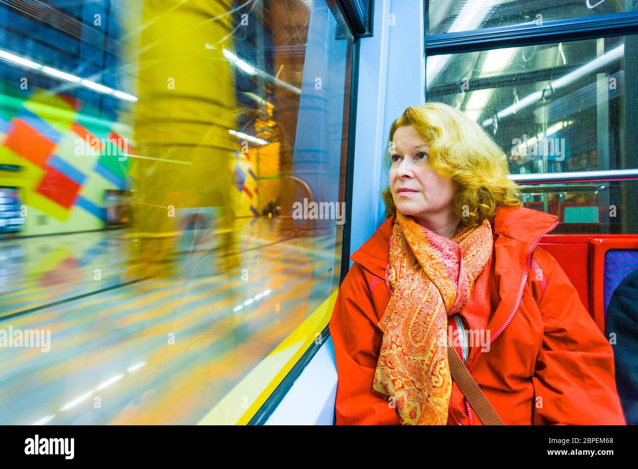woman in subway by night Stock Photo - Alamy