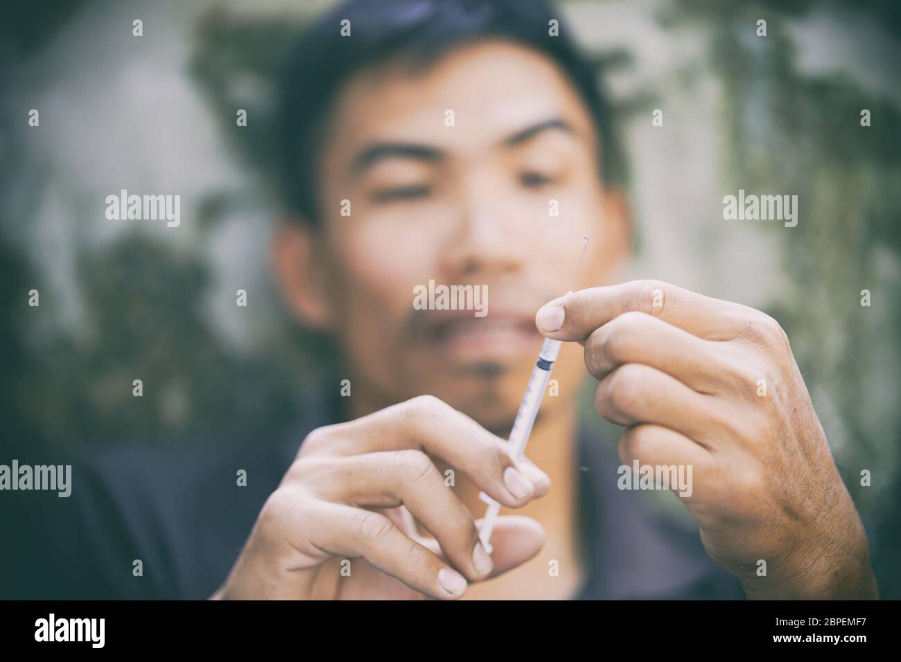 drug addict man with syringe in action Stock Photo - Alamy