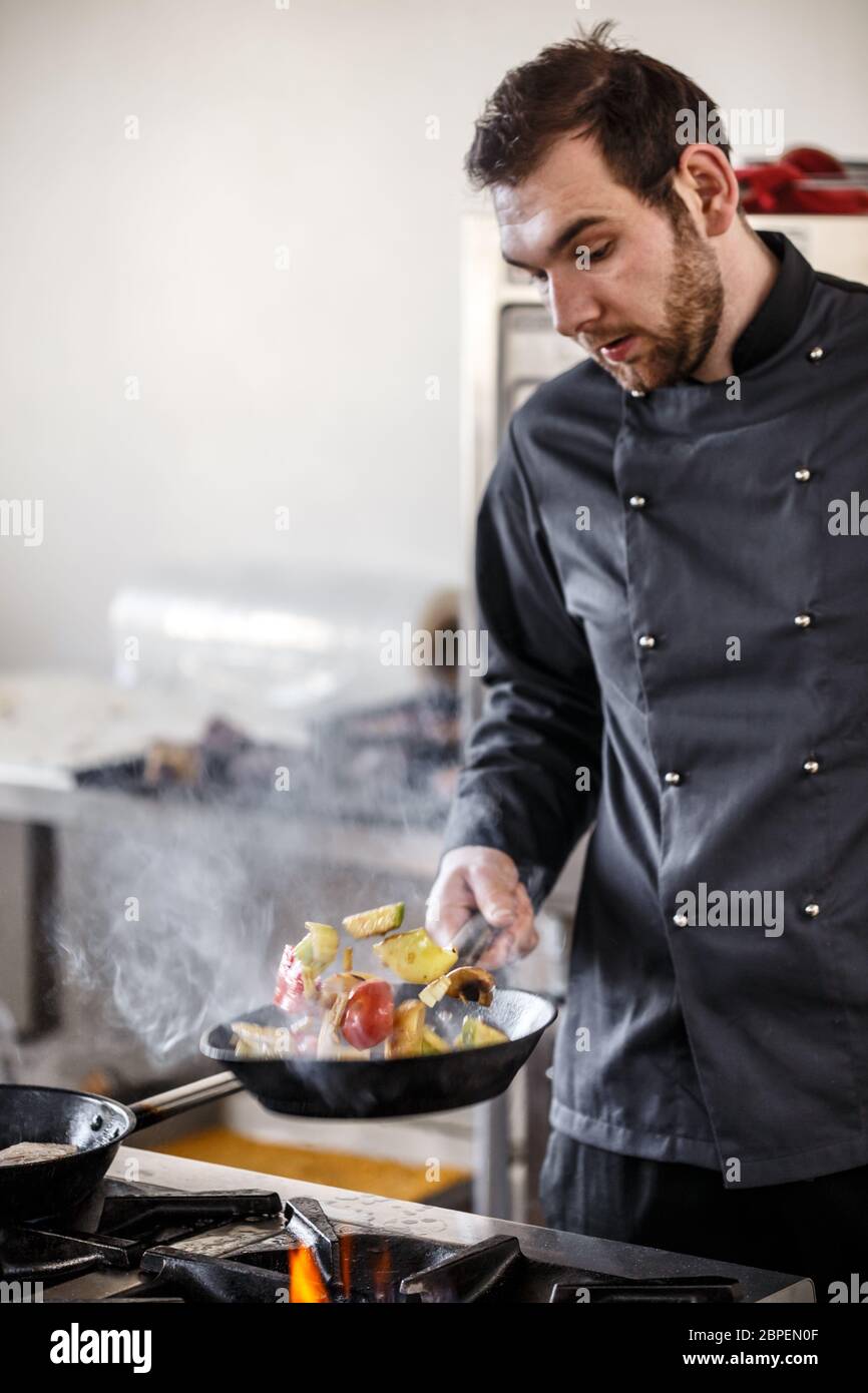 Chef flipping hi-res stock photography and images - Alamy