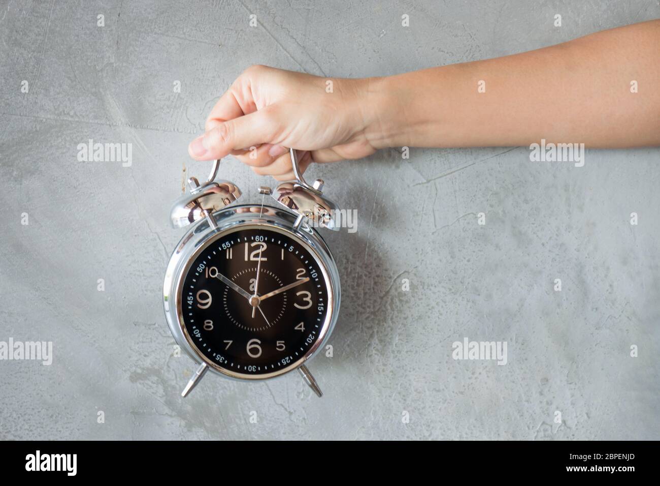 Hand on alarm clock hi-res stock photography and images - Alamy