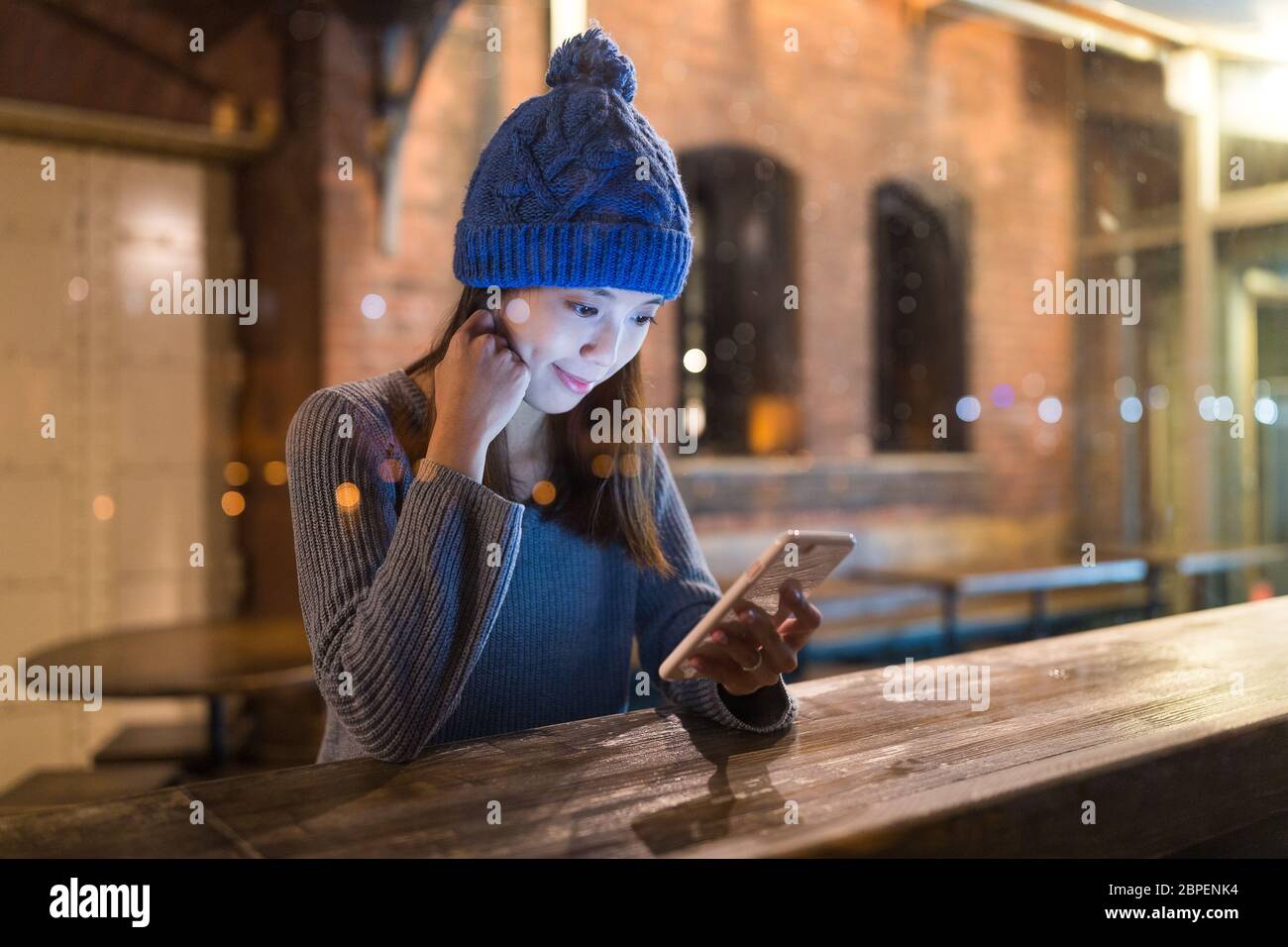 Woman use of mobile phone inside cafe Stock Photo - Alamy