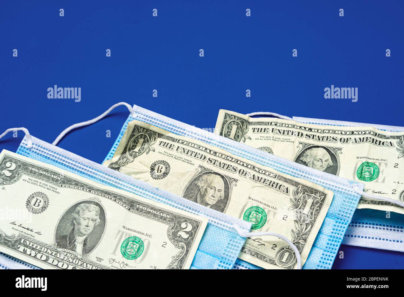 Close up of medical protective masks and american dollar banknotes on ...